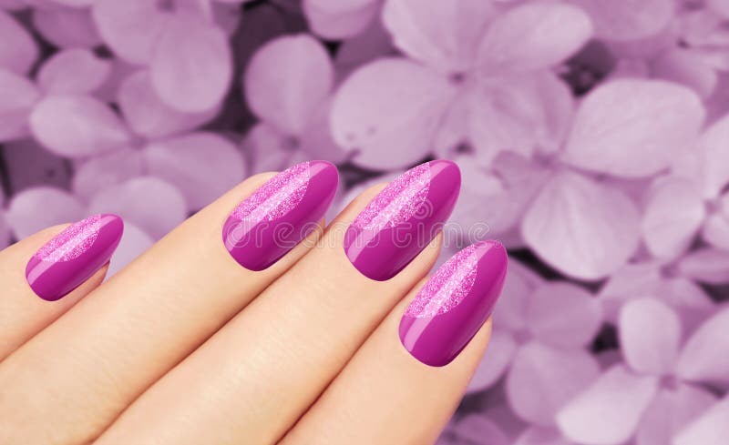 On a Background of Flowers, a Pink Manicure with Pink and Glitter is ...