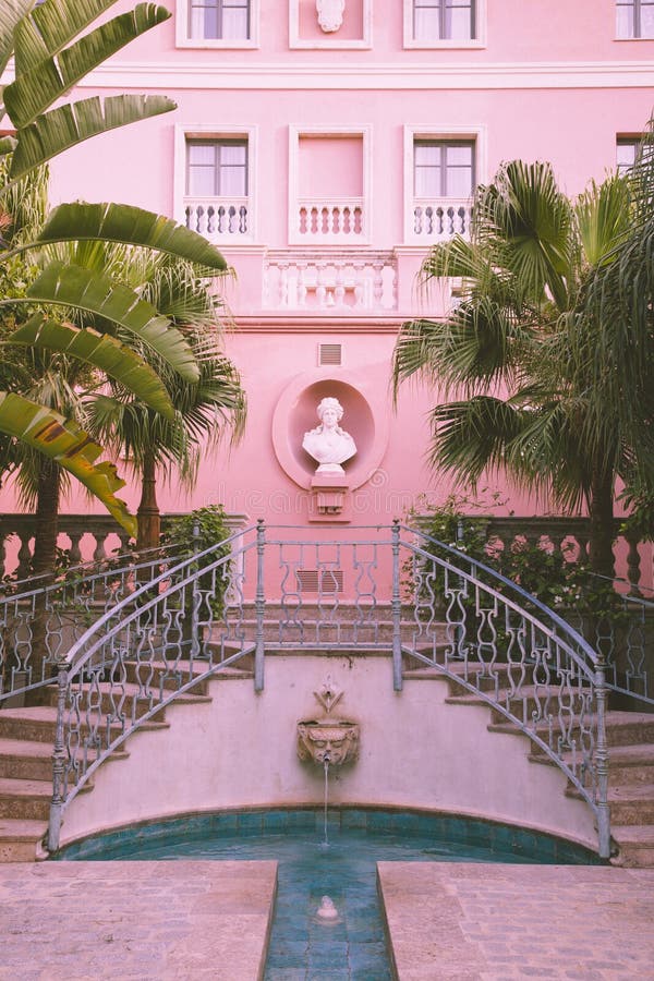 Pink Mansion stock image. Image of palm, weathered, water - 31157645