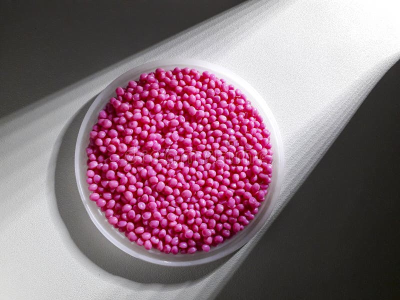 Pink masterbatch granule stock photo. Image of dramatic - 319588328