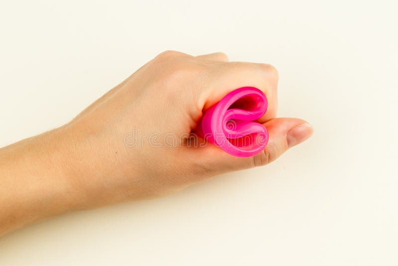 Pink Menstrual Cup Folded with a C-Fold Method Stock Image - Image of ...