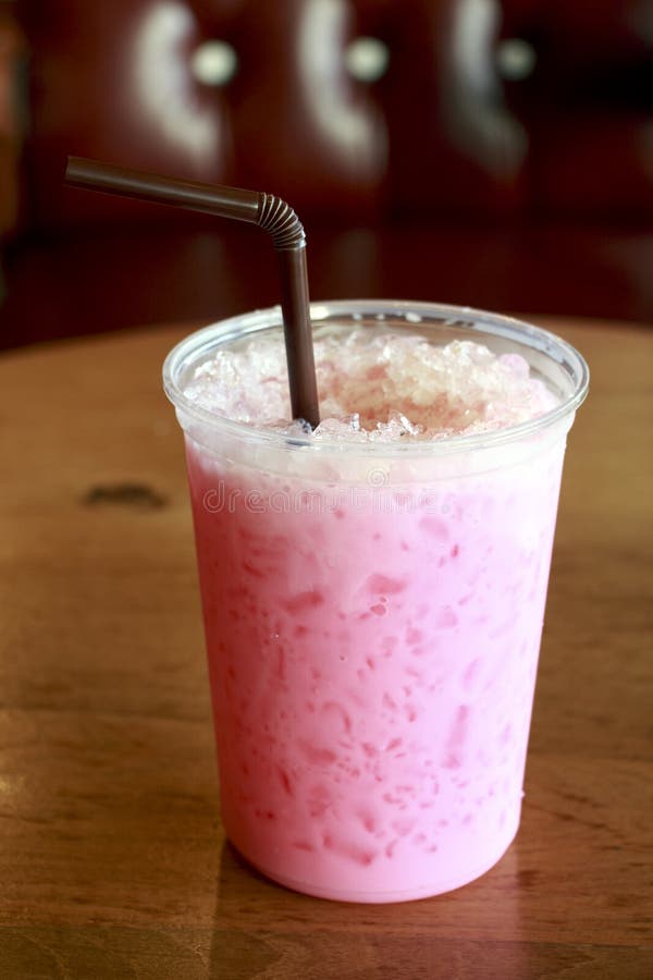 Pink milk in plastic glass stock image. Image of pink - 64532415