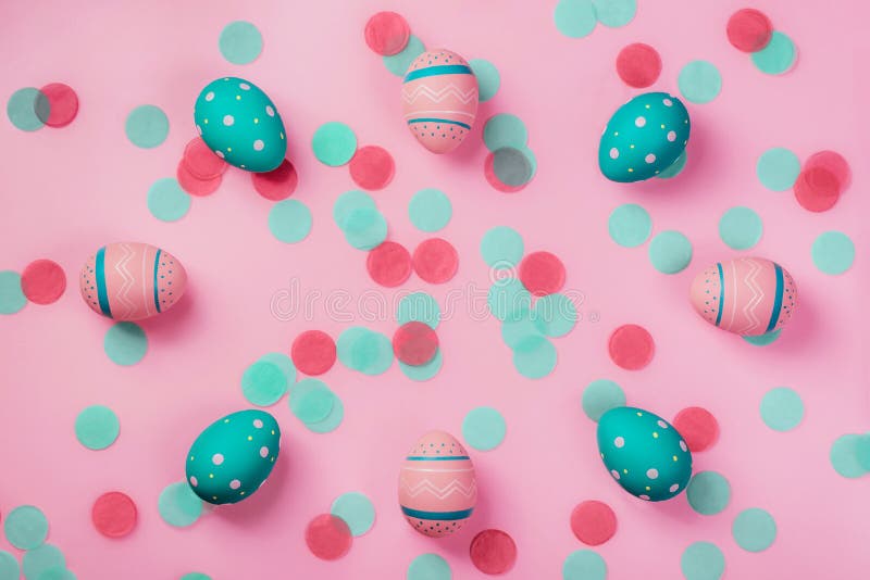 Pink and Mint Colored Decorated Eggs on Pink Background with Confetti ...
