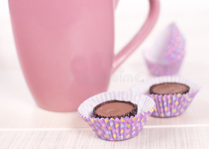 Pink Mug and Peanut Butter Cupcakes Stock Image - Image of snack, candy ...