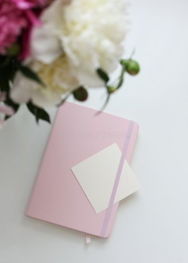 A Pink Notepad with a Blank Message Card on Top of it Stock Photo ...