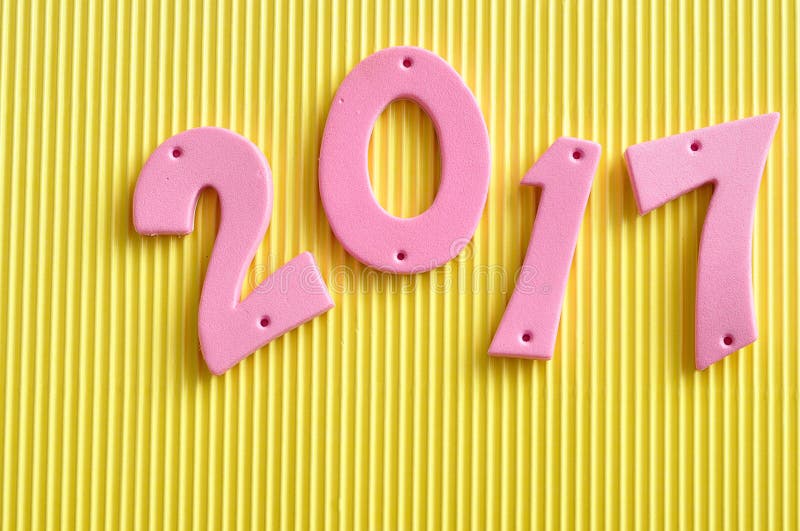 2017 In Pink Numbers Against A Blue Background Stock Photo - Image of ...