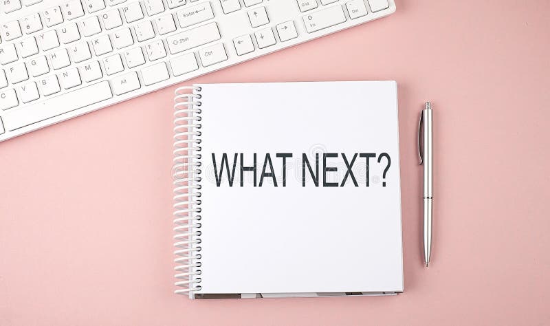 Pink Office Desk with Keyboard and Notebook with Text WHAT NEXT Stock ...