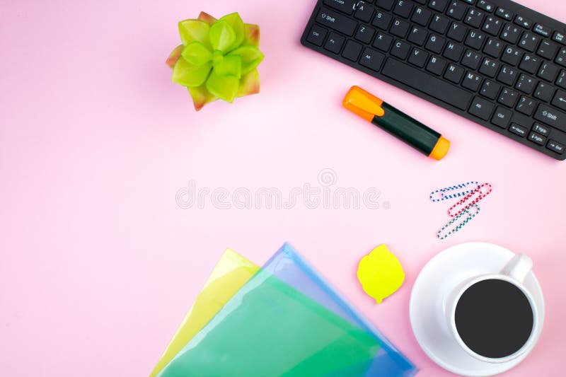 Pink Office Table with Computer, Pen and a Cup of Coffee, Lot of Things ...