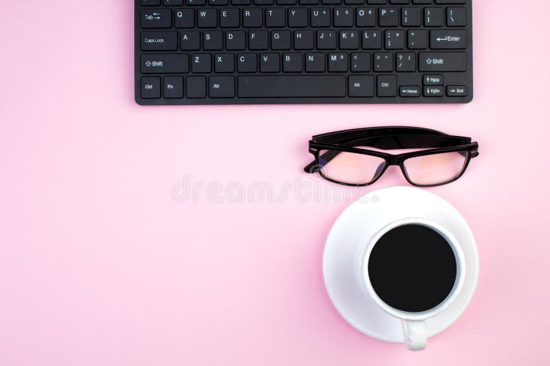 Pink Office Table with Computer, Pen and a Cup of Coffee, Lot of Things ...