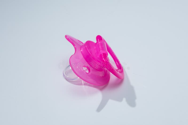 Pink Pacifier on White Background Stock Photo - Image of comfort, clean ...