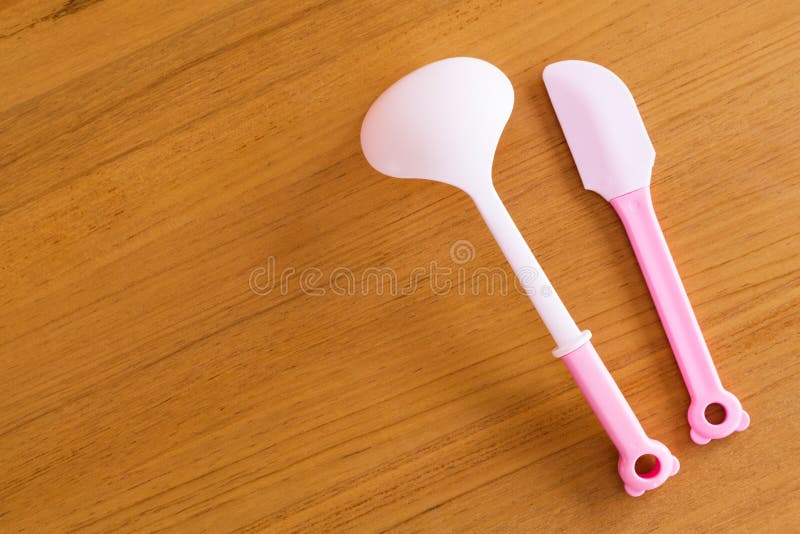 Pink Paddle and Ladle on Wooden Table Stock Photo - Image of board ...