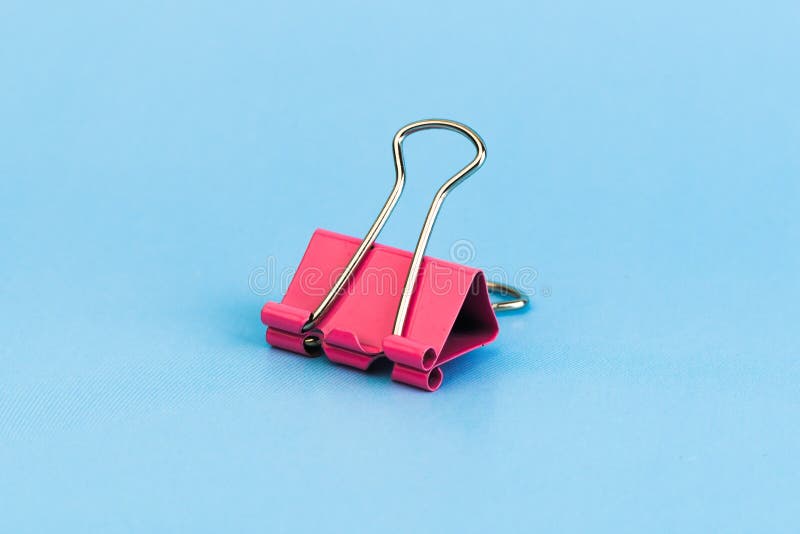 Pink Paper Clamp Isolated on Blue Stock Image - Image of clip, paper ...