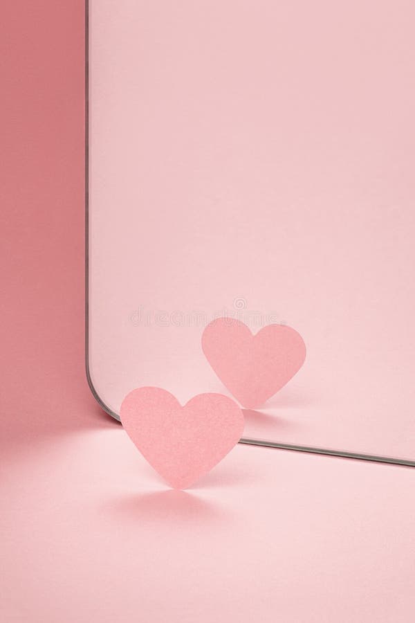 Pink Paper Heart in Front of a Mirror and in Reflection Stock Photo ...