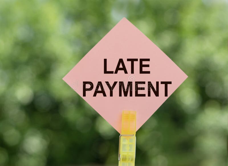 Pink Paper Note with Late Payment Message on a Green Background Stock ...