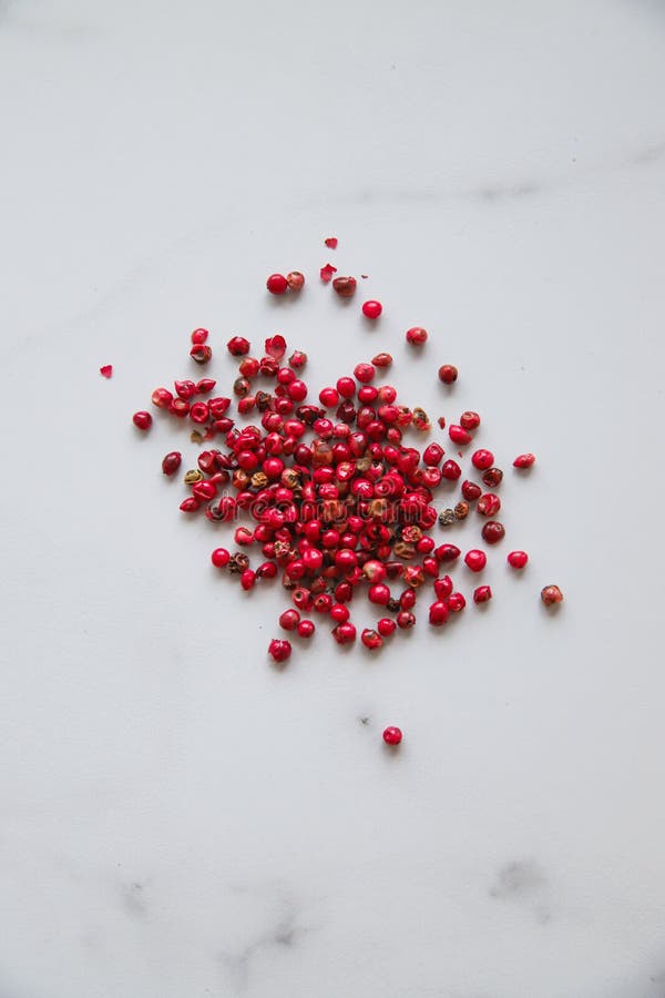 Pink Pepper is Scattered on Marble Surface Stock Photo - Image of ...