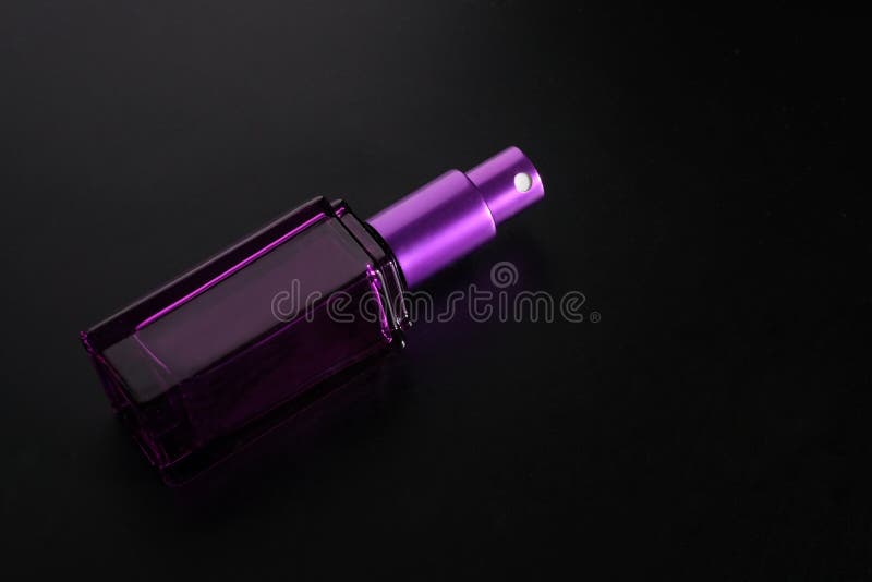 Pink Perfume Bottle on a Black Background. Side View, Close-up Stock ...