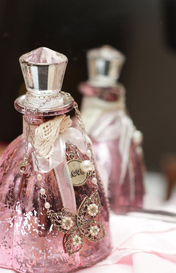Pink Perfume Bottle with Pendant Stock Image - Image of aromatic, light ...