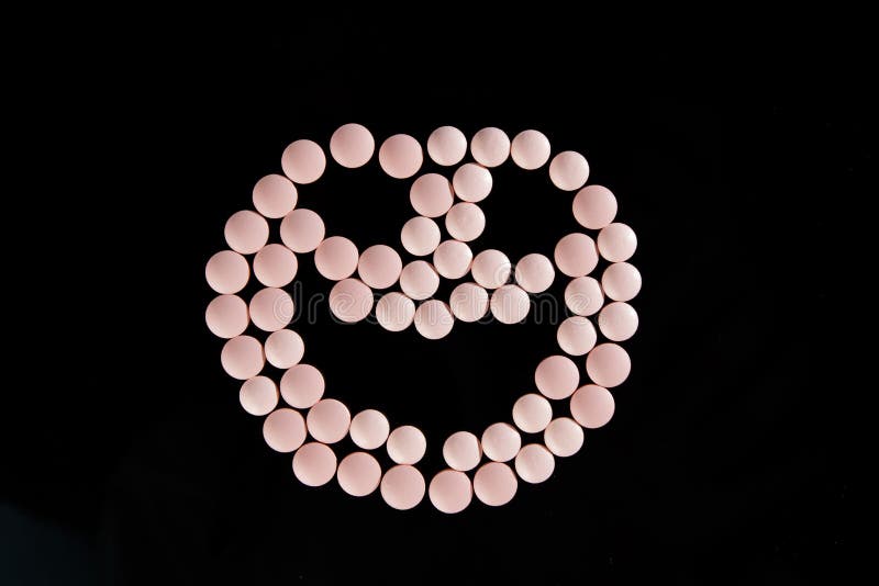 Pink pills happy face stock photo. Image of heap, assistance - 65215150