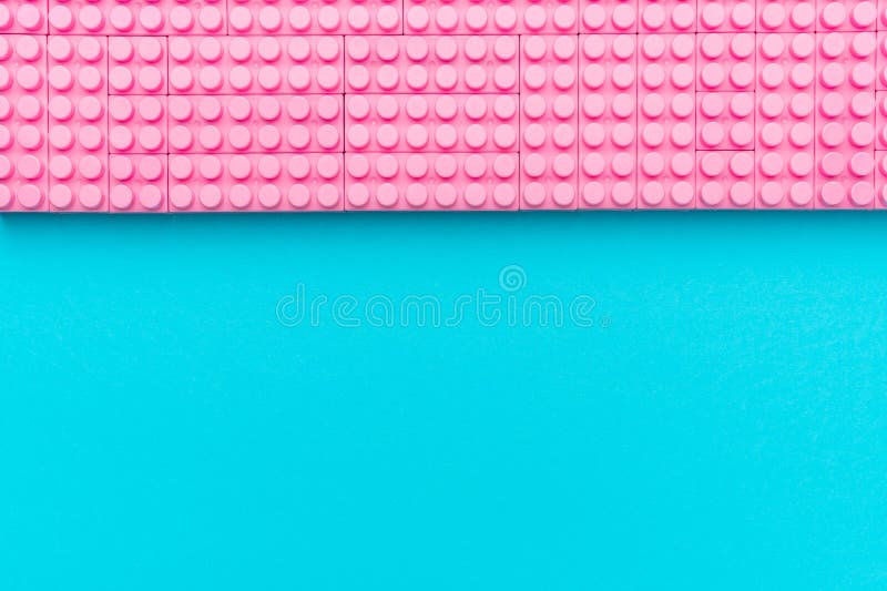 Pink Plastic Blocks on Turquoise Blue Background Stock Image - Image of ...