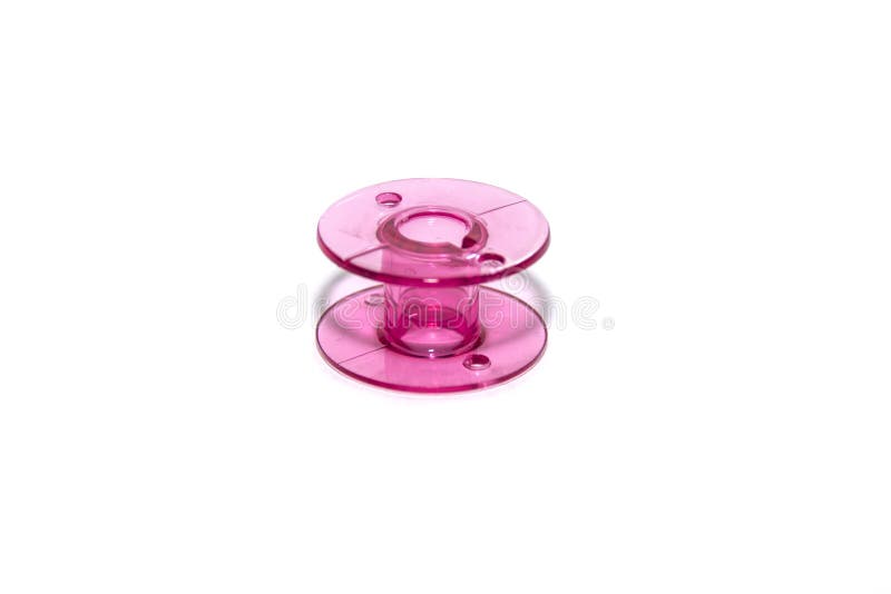 Pink Plastic Bobbin for Sewing Machine Stock Photo - Image of sewing ...