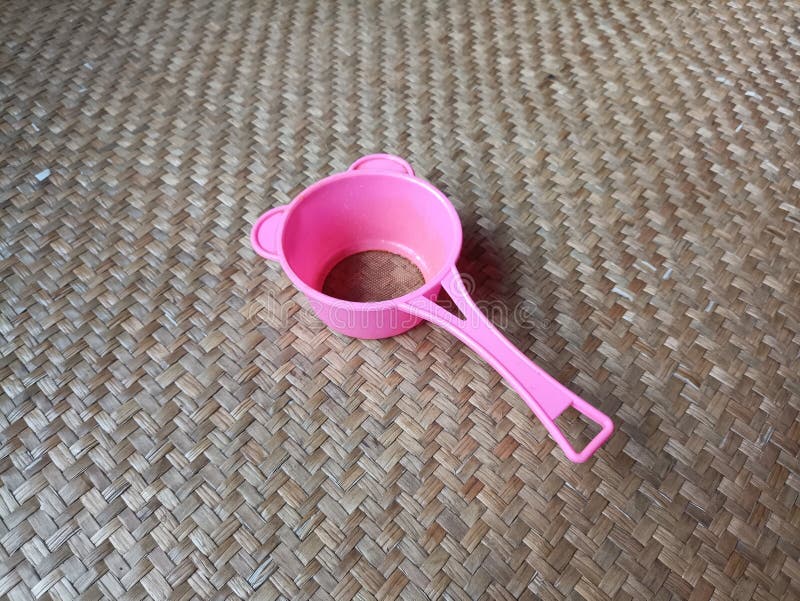 Pink Plastic Tea Strainer on a Woven Pandan Leaf Mat Stock Photo ...