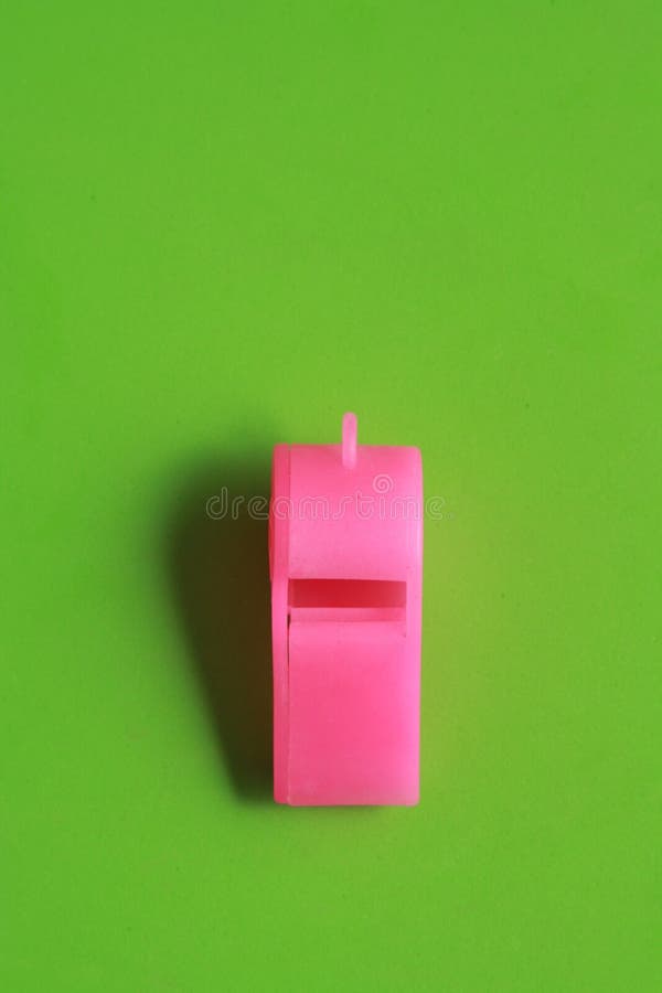 Pink Plastic Whistle Toy Isolated on a Green Background Stock Image ...