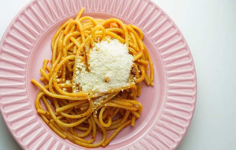 Pink Plate of Fresh Spaghetti with Tomato Sauce and Parmesan Cheese ...