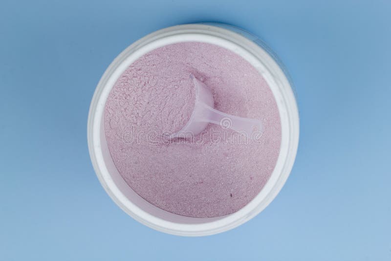 Pink Protein Powder with Spoon in Blue Background Stock Image - Image ...