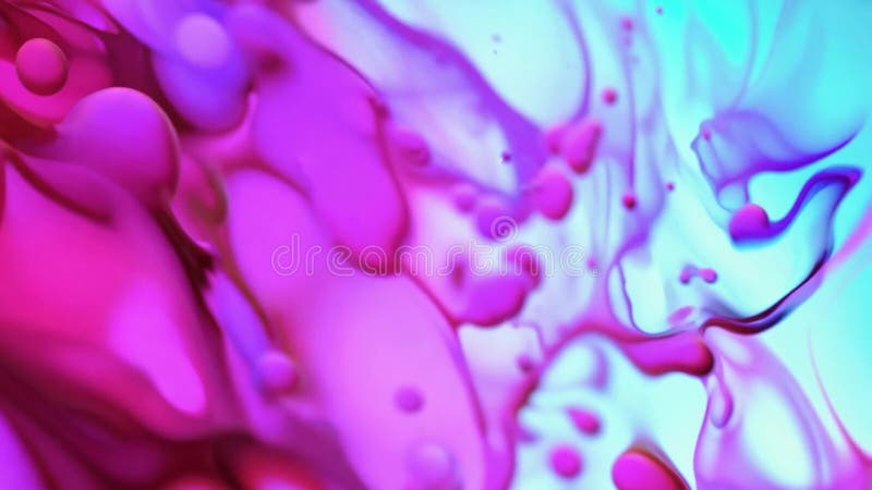 Pink and Purple Fluids Mixing and Swirling Together, Creating a ...