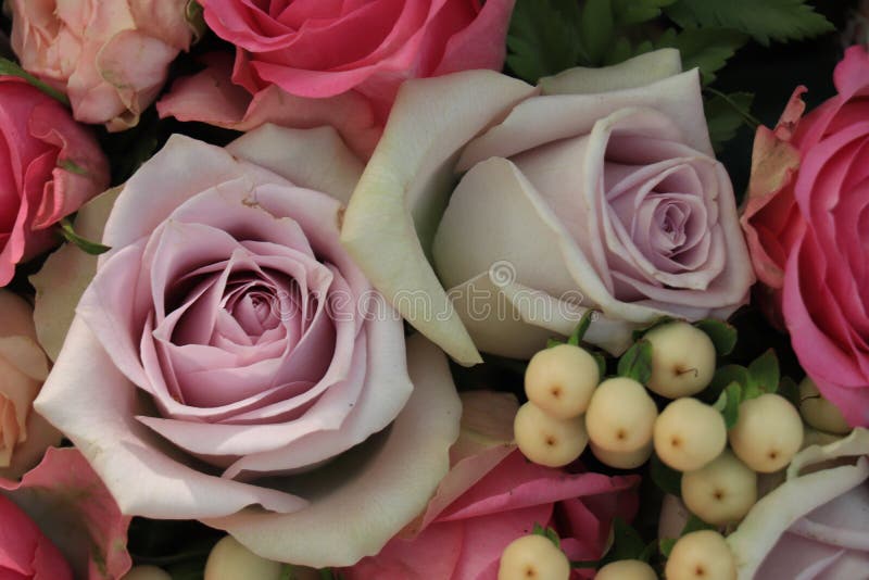 Pink and Purple Roses in a Wedding Centerpiece Stock Image - Image of ...