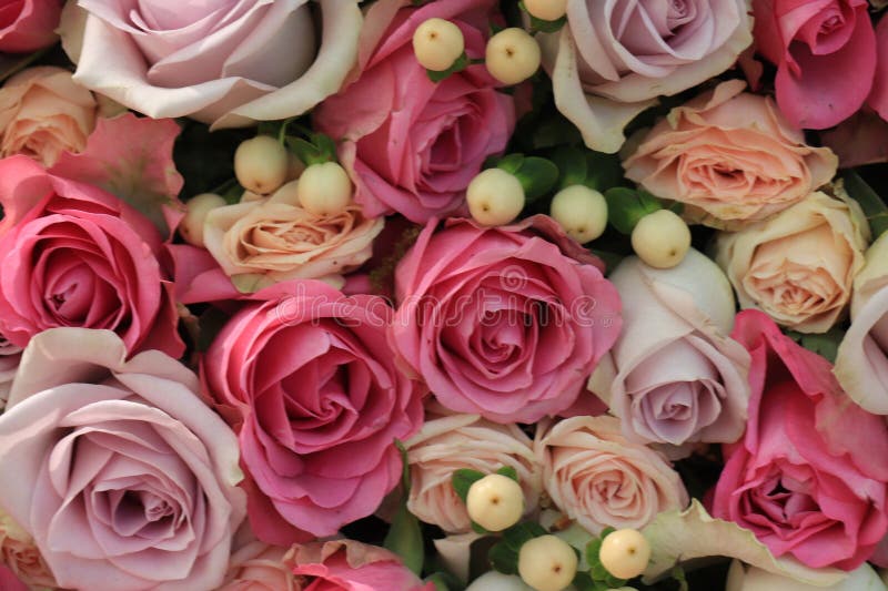 Pink and Purple Roses in a Wedding Centerpiece Stock Photo - Image of ...