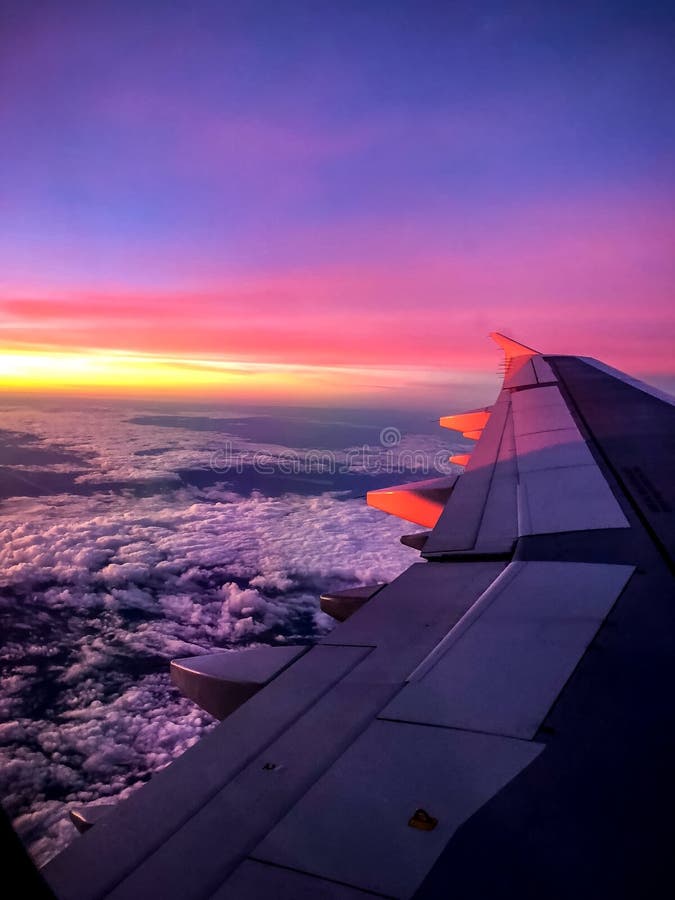 Pink and Purple Sunset in the Clouds Stock Photo - Image of plane, road ...