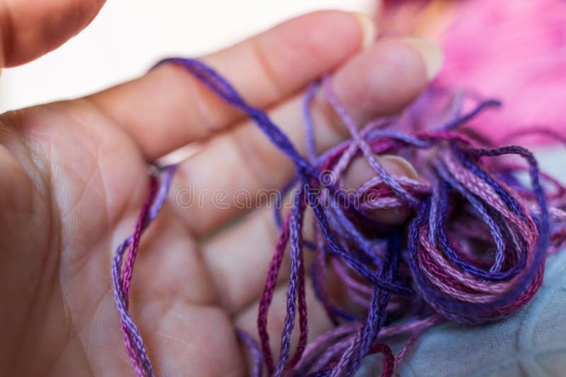Pink and Purple Thread in Hand Stock Photo - Image of detail, balls ...