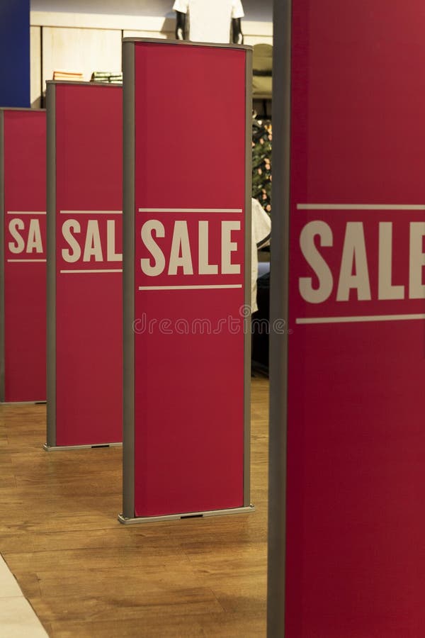 Pink Racks with the Inscription Sale in the Store. Vertical Stock Image ...