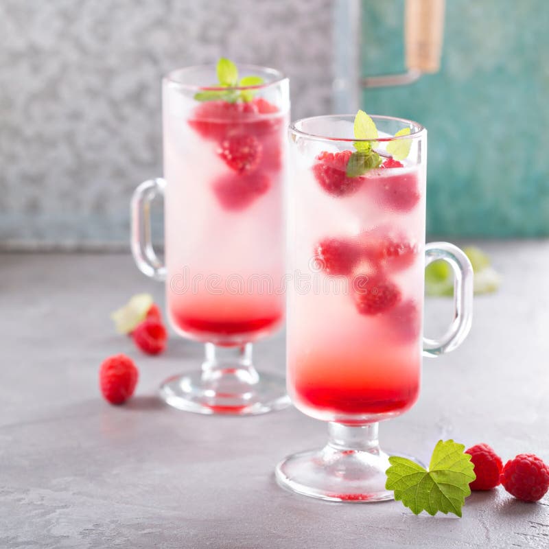 Pink Raspberry Lemonade in Tall Glasses Stock Photo - Image of leaf ...