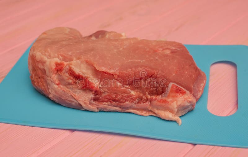 Pink Raw Pork Lie on a Blue Board. Appetizing Meat. Pork on Blue Board ...