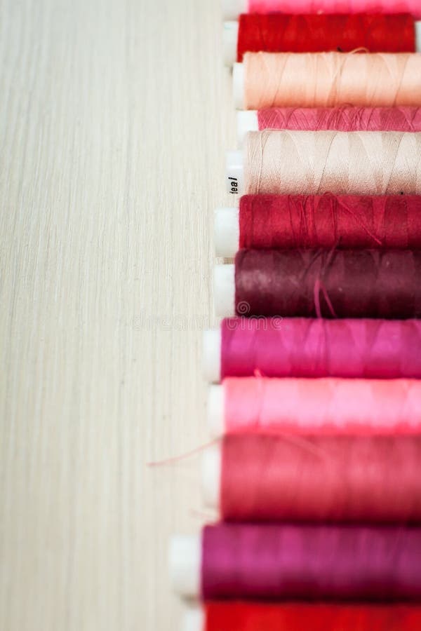 Pink and Red Sewing Threads on Wood Table. Top View with Space for Text ...