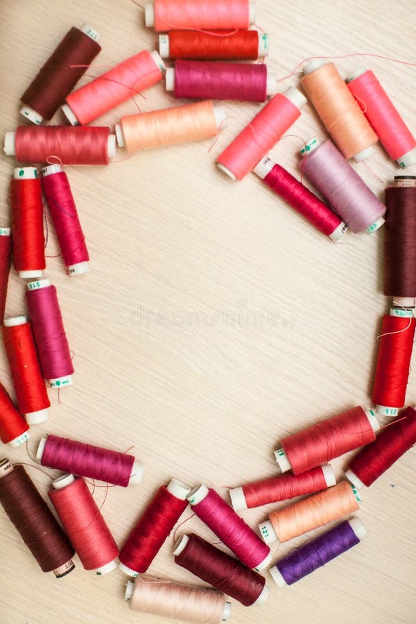 Pink and Red Sewing Threads on Wood Table. Top View with Space for Text ...