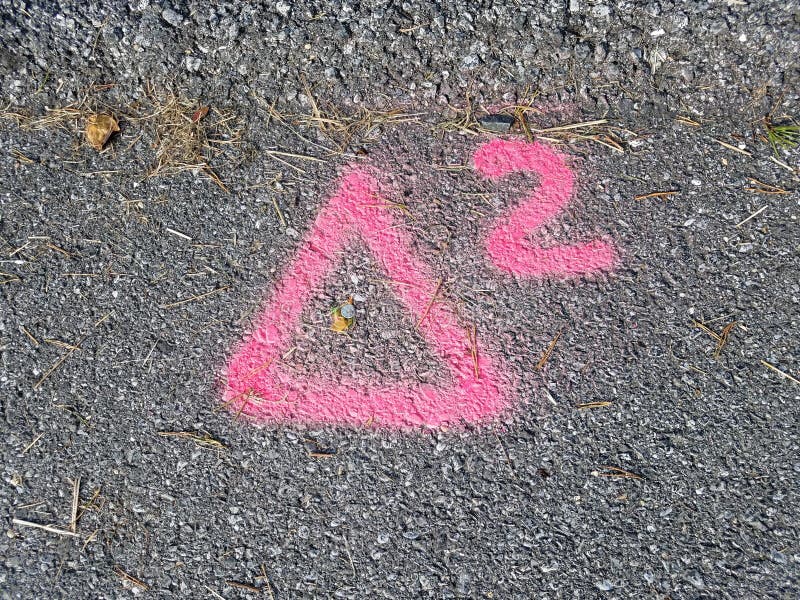 Pink or Red Triangle with the Number 2 Painted on Asphalt Stock Image ...