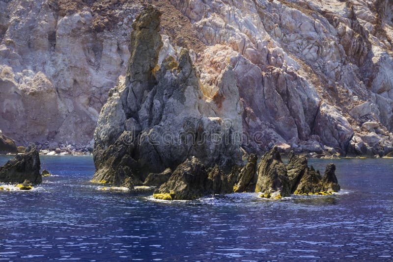Pink Rock Surrounded by Blue Water. Stock Photo - Image of surrounded ...
