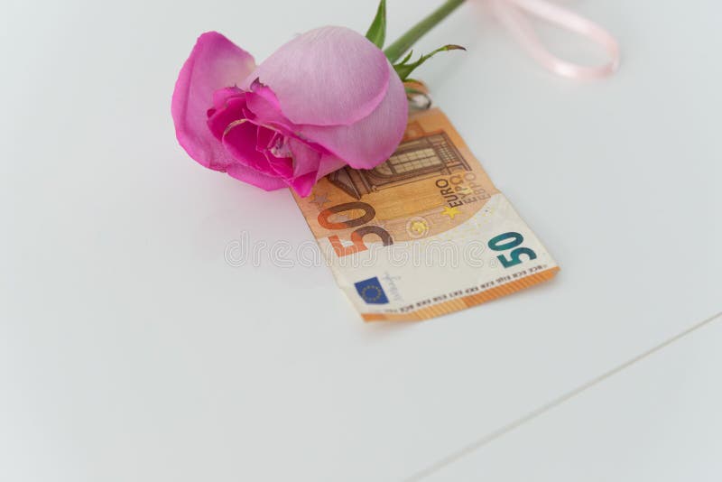 A Pink Rose As a Gift with a Euro Banknote Stock Photo - Image of stack ...