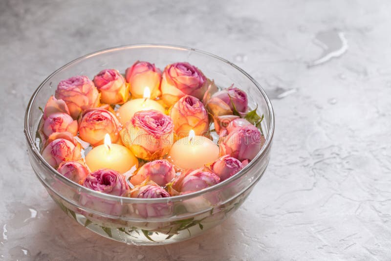 Pink roses and candles stock photo. Image of calmness - 110302916