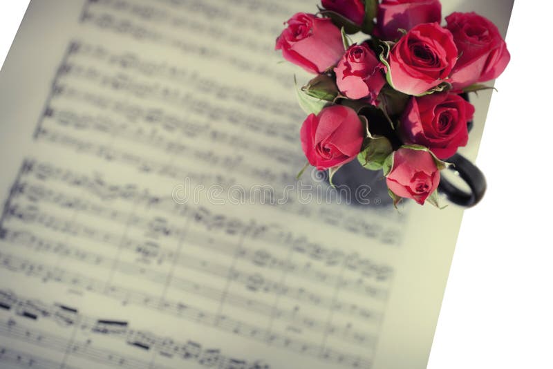 Two Pink Roses on Sheets of Musical Notes Stock Image - Image of note ...