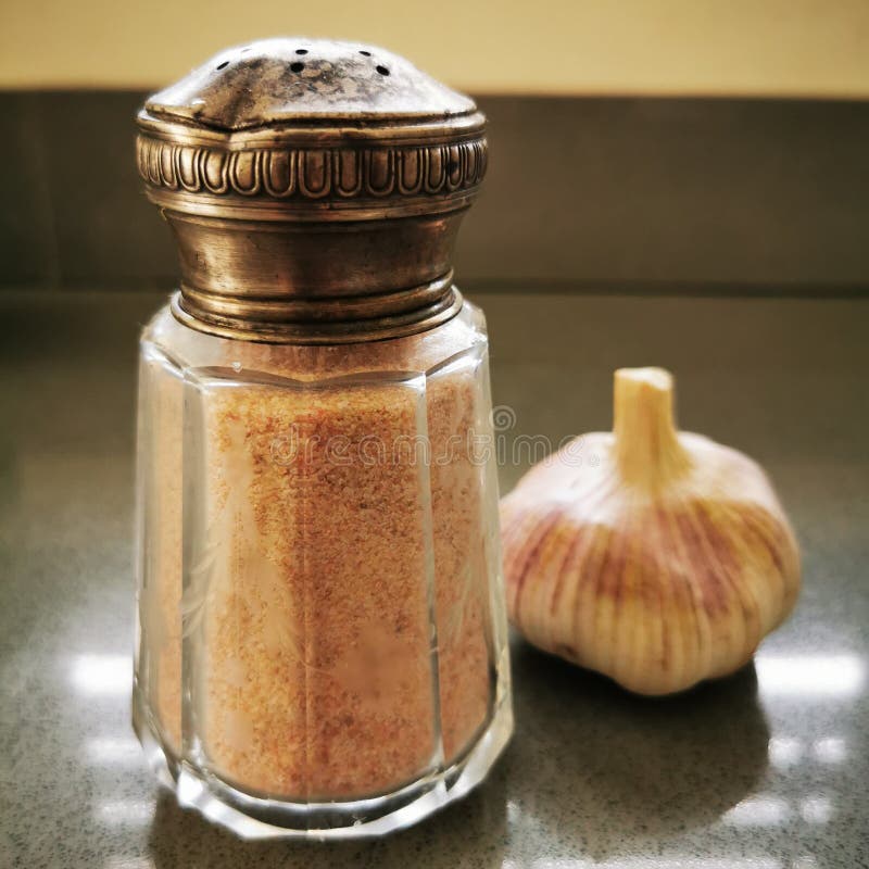 Pink Salt in an Antique Salt Shaker and Garlic. Stock Photo - Image of ...