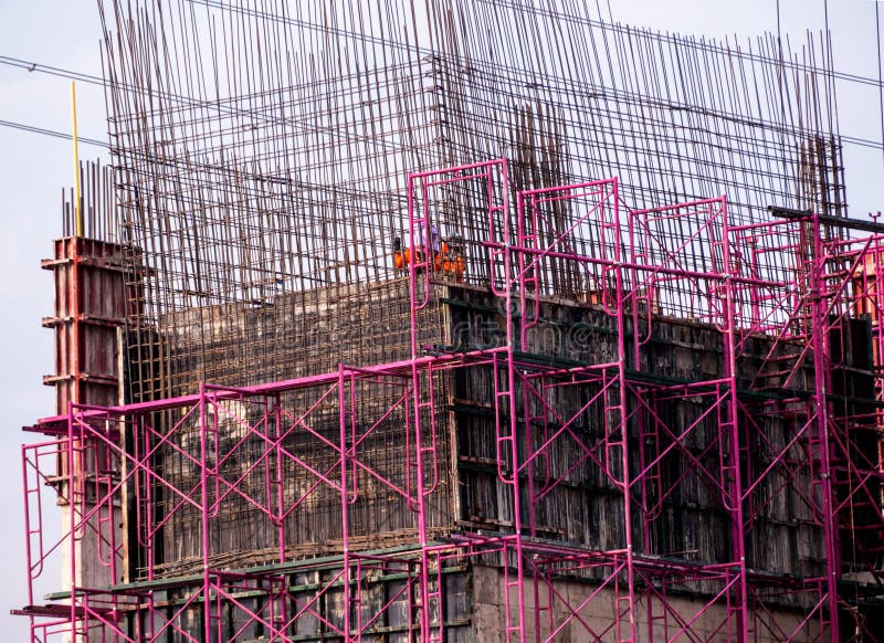 The Pink Scaffolding on the Building Under Construction Stock Photo ...