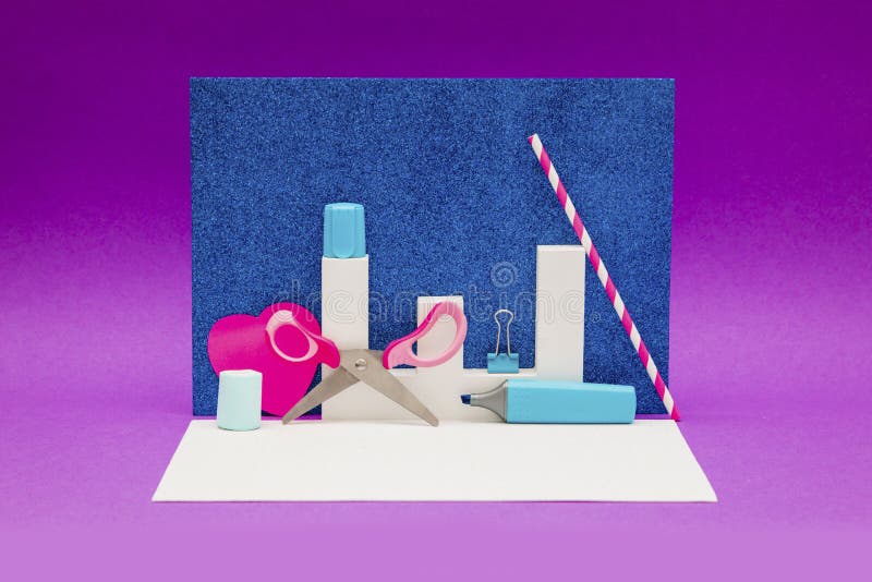 Scissors, Marker and Other Decorations on a Purple and Shiny Blue ...