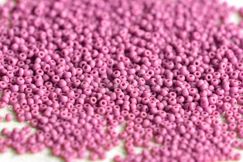 Pink Seed Beads Scattered on a Textile Surface Close Up. Handmade ...