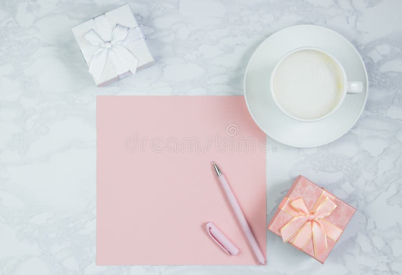 Pink Sheet of Paper, Pink Pen, Cup of Coffee and Gift Boxes on the ...