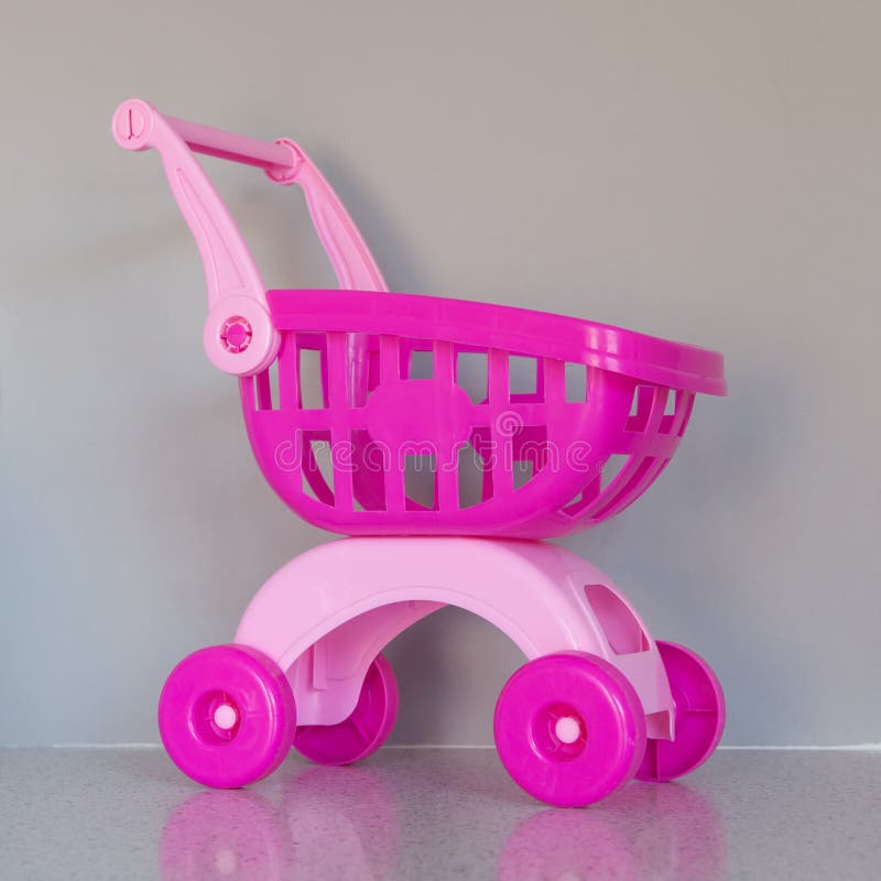 Pink shopping cart stock image. Image of merchandise - 58200375