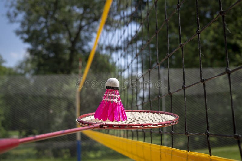 Pink Shuttlecock on Racket and Badminton Net Stock Image - Image of ...