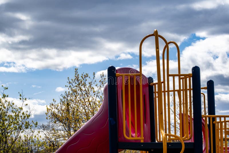 Pink Slide Under a Cloudy Sky Stock Photo - Image of cloudy, shows ...